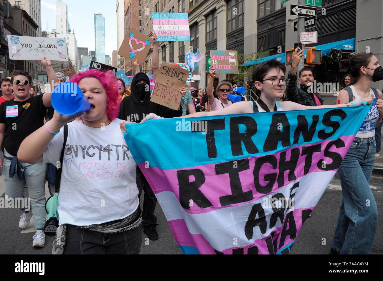 New York, United States. 31st Mar, 2025. Demonstrators hold a banner at ...