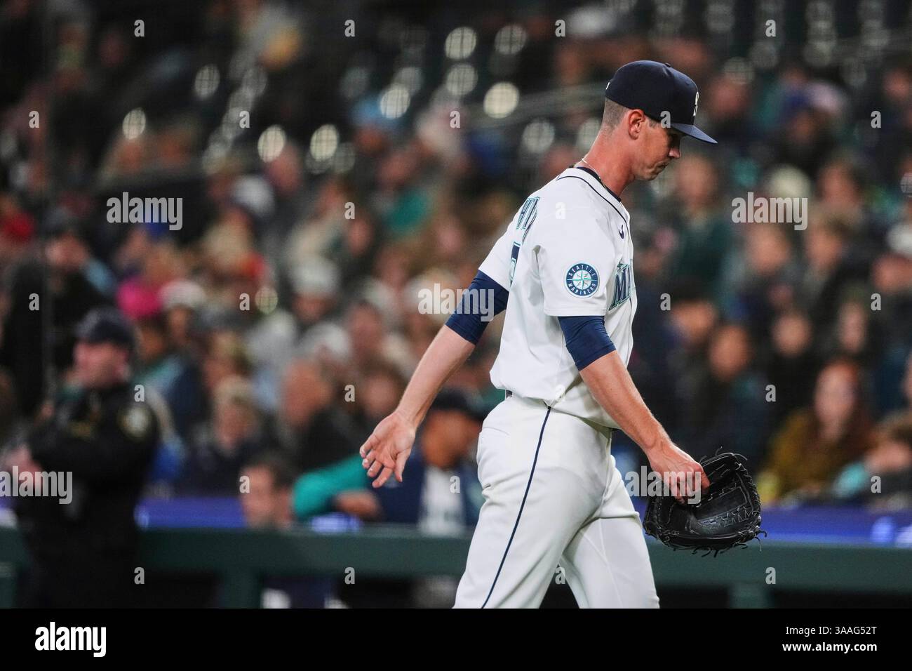 Seattle Mariners starting pitcher Emerson Hancock walks back to the ...