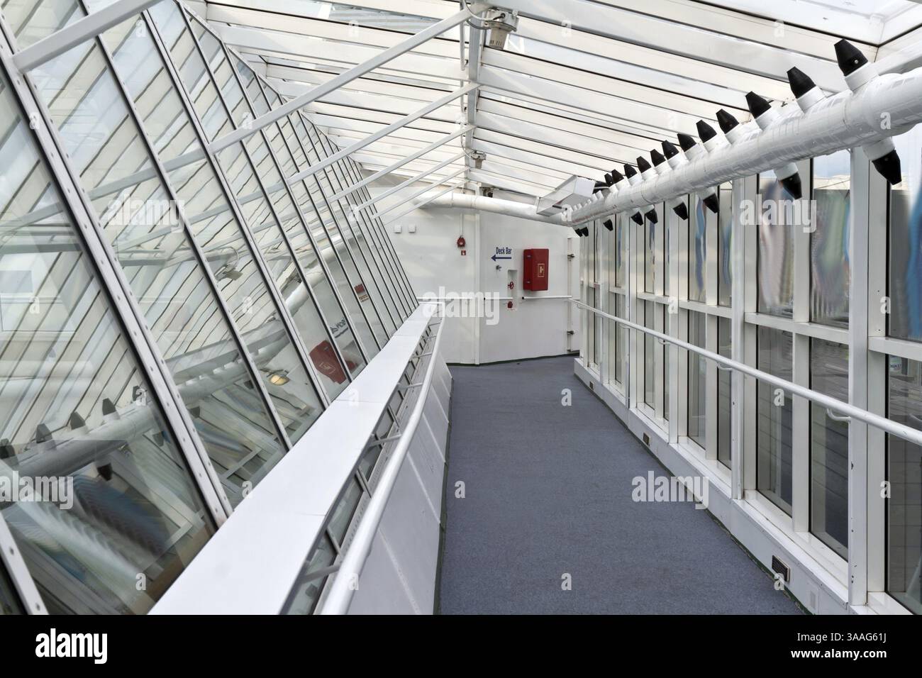 Ship corridor with windows and handrails Stock Photo - Alamy