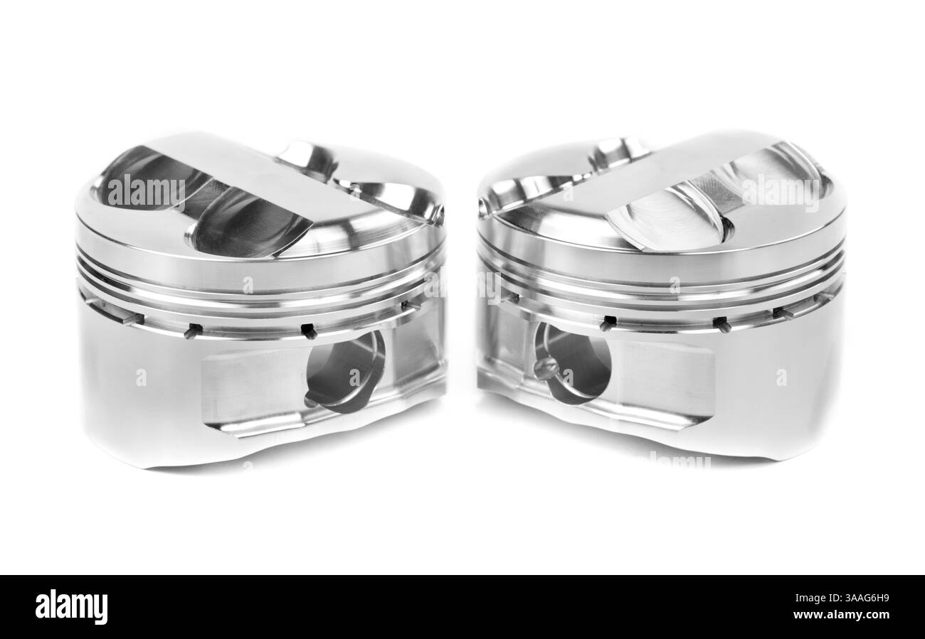 Set of two polished forged pistons. Isolate on white Stock Photo - Alamy
