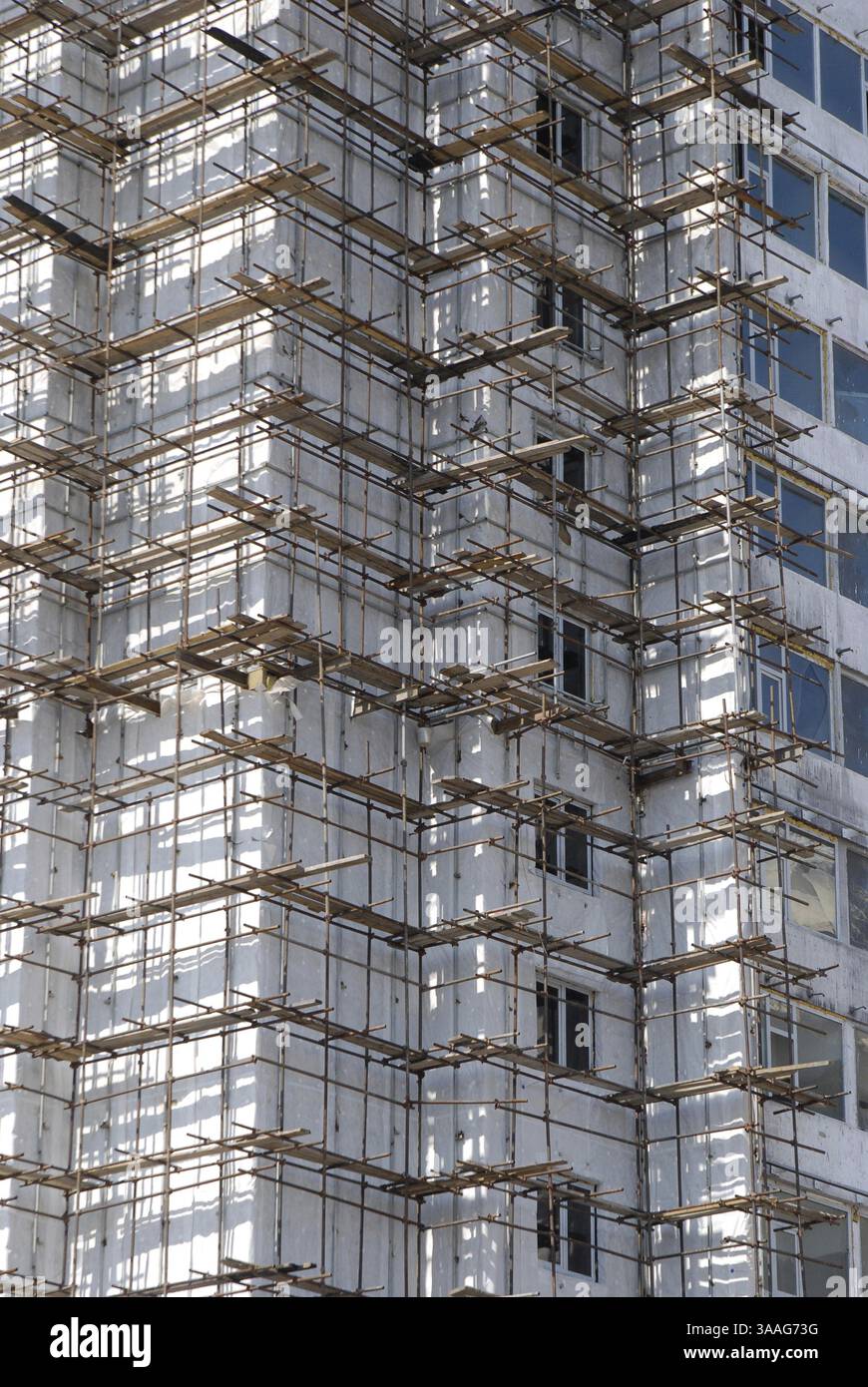 A multistorey panel building under construction, in scaffolding Stock ...