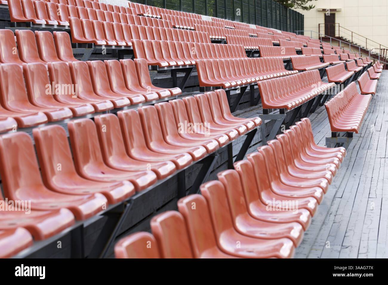 Stadium curve, brown seat on stadium steps bleacher Stock Photo - Alamy