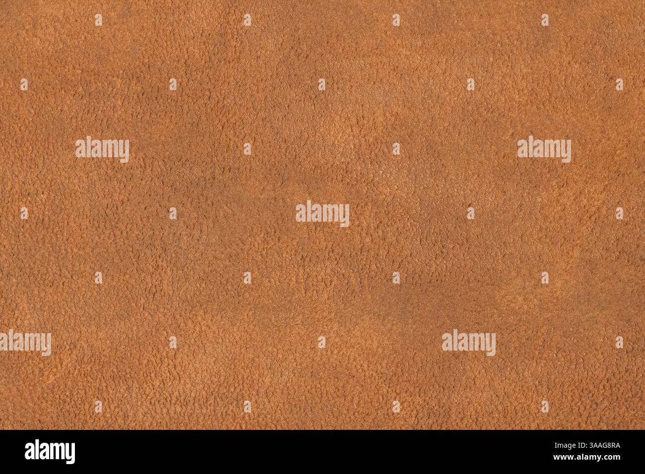 Natural light brown suede texture. Genuine shammy-leather with slight shabby texture, pattern or ...