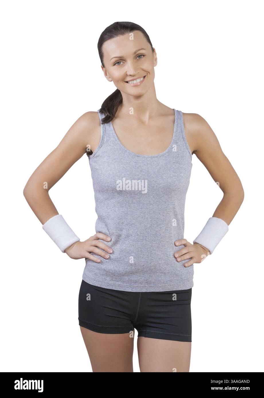 Beautiful sporty female with arms on hips wearing sports clothes ...