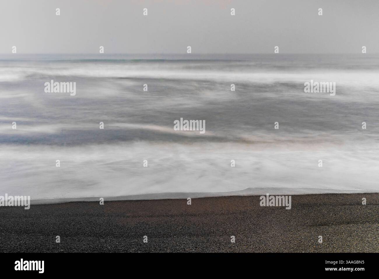 Long exposure of Pacific Ocean surf lapping up on Gold Bluffs Beach ...