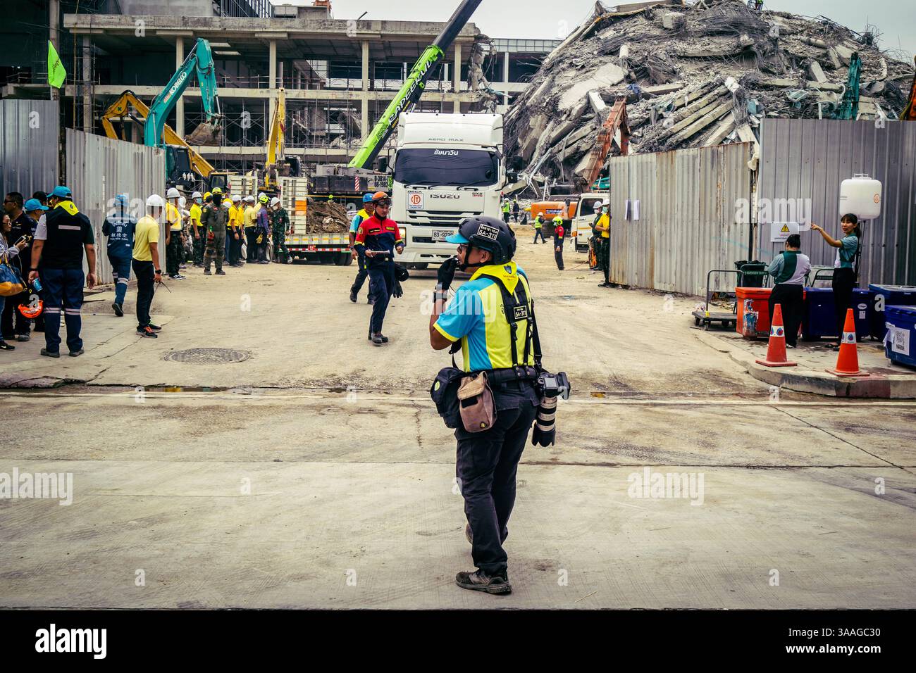 Bangkok, Thailand, March 31, 2025 Rescuers work at the site of a high ...