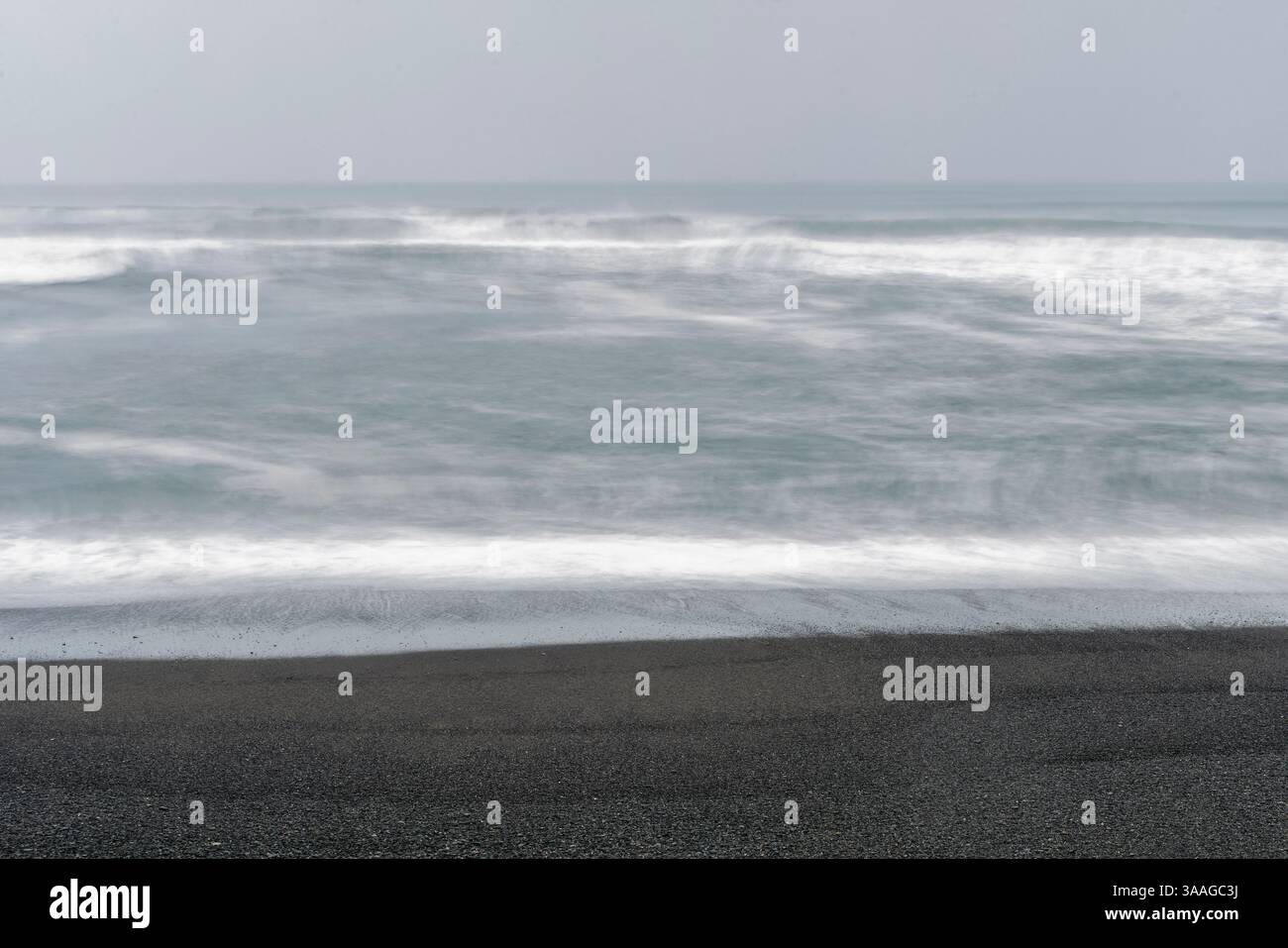 Long exposure of Pacific Ocean surf lapping up on Gold Bluffs Beach ...
