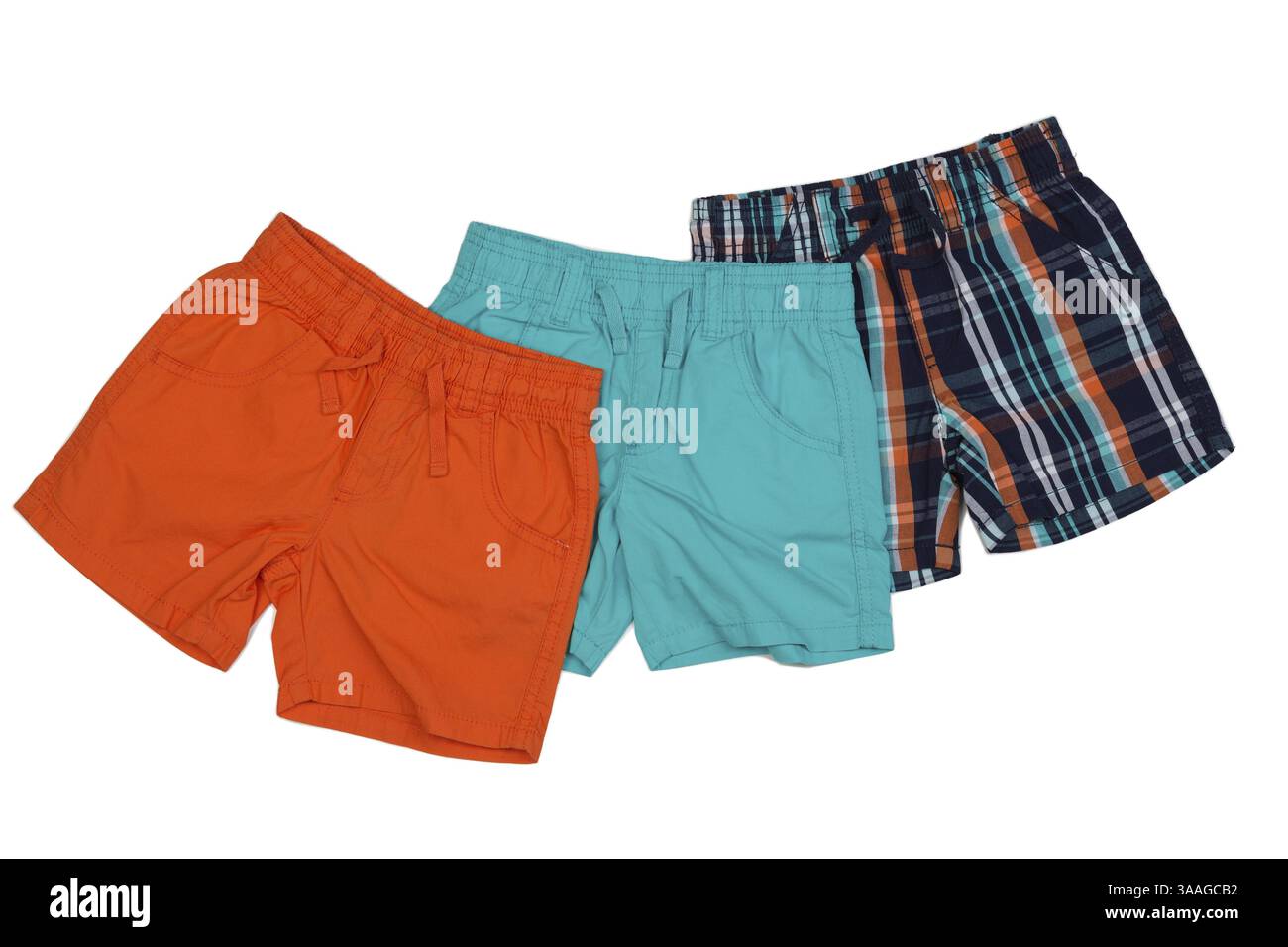 Three colored shorts, orange, blue and plaid. Isolate on white Stock ...