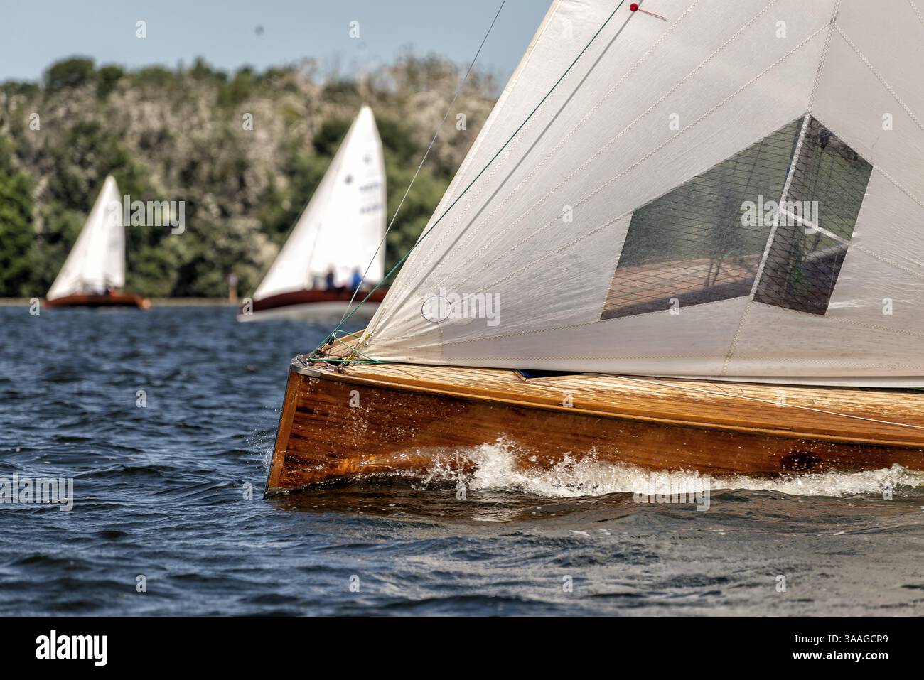 Classic sailing yacht sailing on a lake during a regatta Stock Photo ...