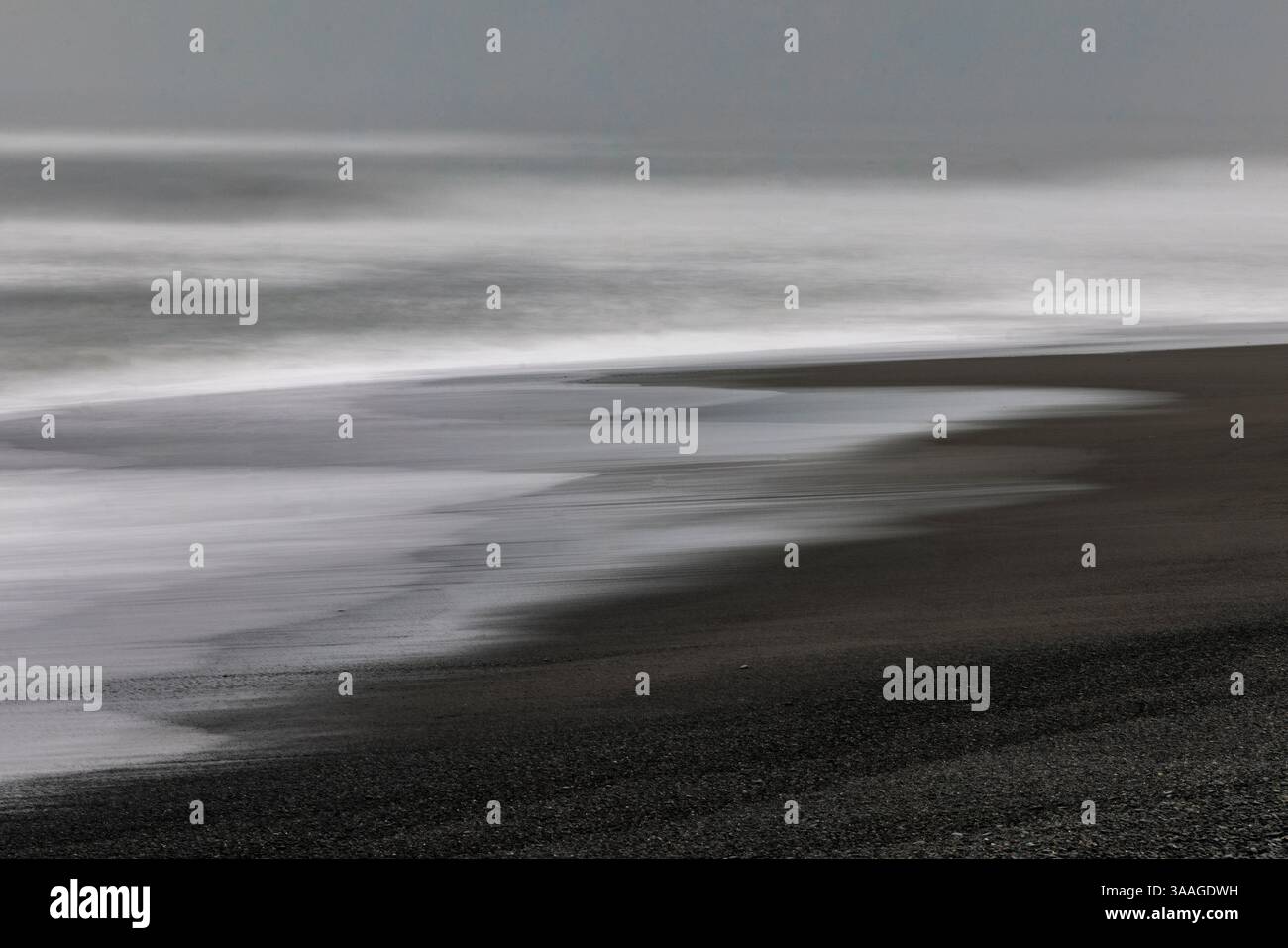 Long exposure of Pacific Ocean surf lapping up on Gold Bluffs Beach ...