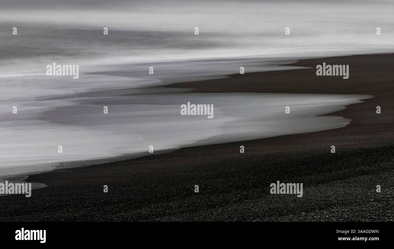 Long exposure of Pacific Ocean surf lapping up on Gold Bluffs Beach ...