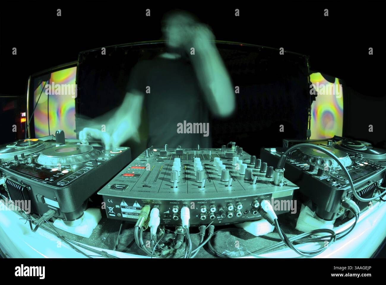 Blurred dj at spin table in night club Stock Photo - Alamy