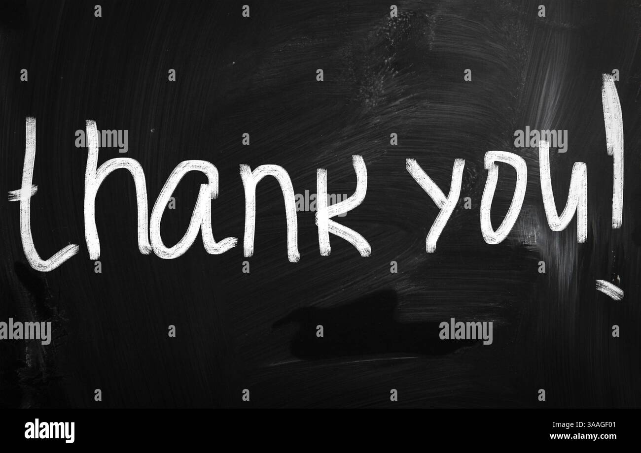 Thank you handwritten with white chalk on a blackboard Stock Photo - Alamy