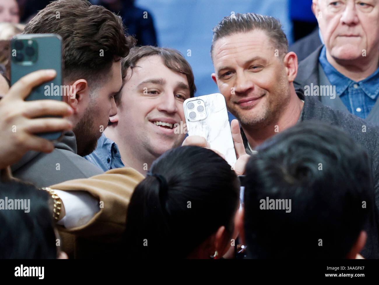 New York, United States. 31st Mar, 2025. Tom Hardy greets fans when he ...