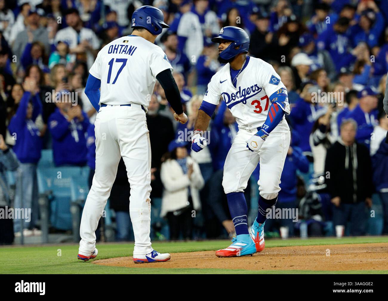 Los Angeles Dodgers' Teoscar Hernández (37) celebrates at home plate ...