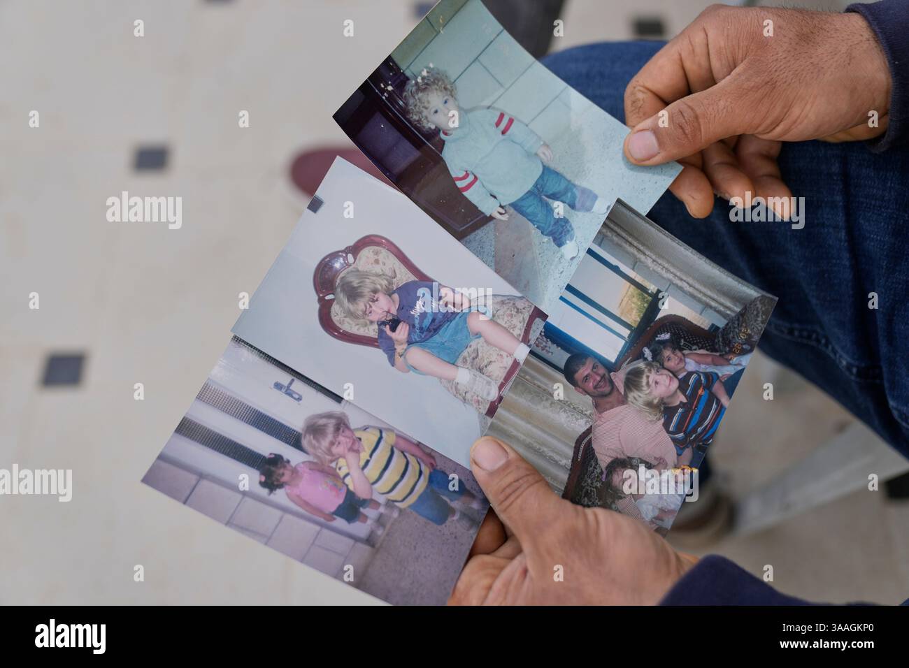 Khalid Ahmad, holds childhood photos of his son, Waleed, at his family ...