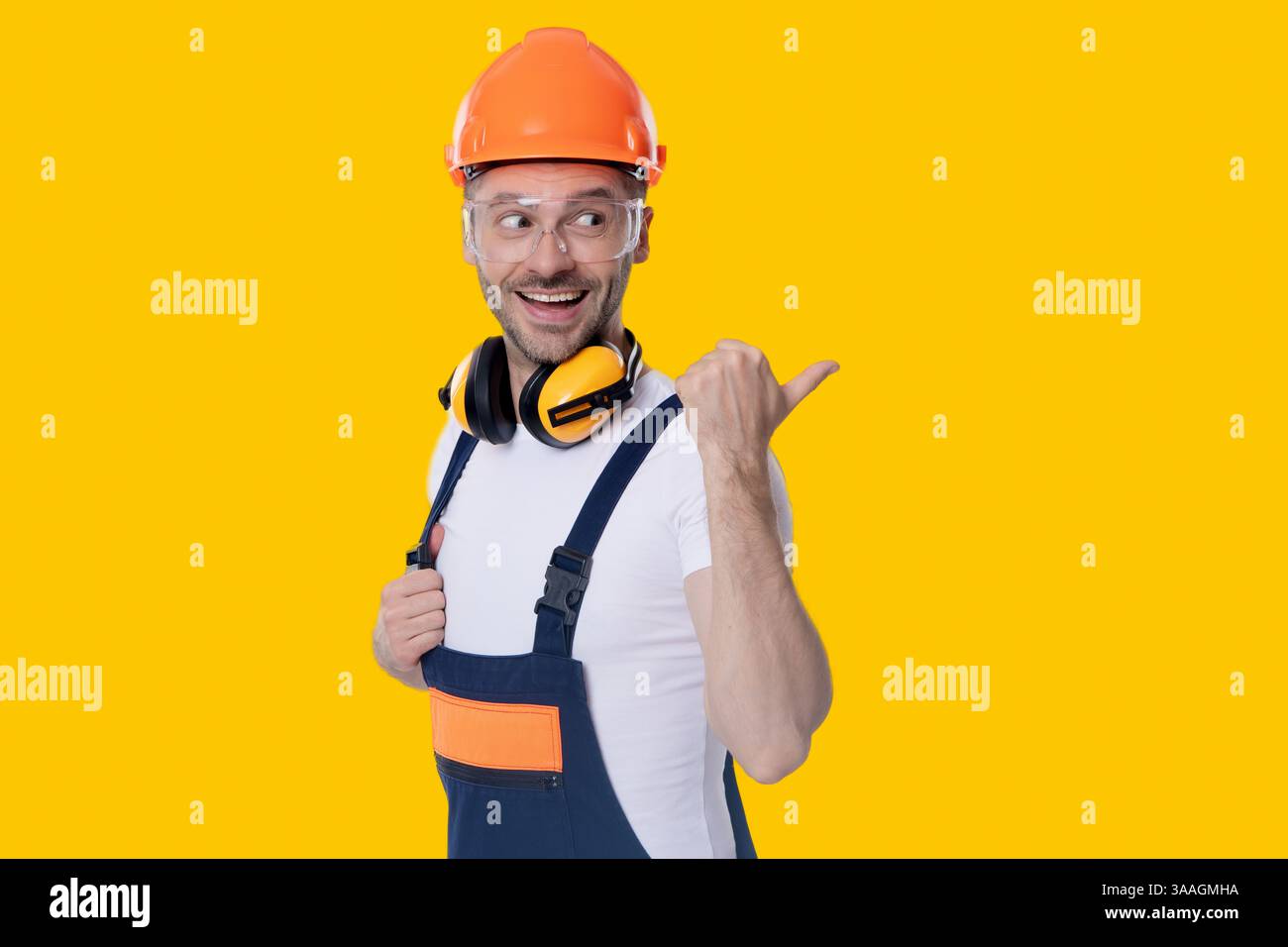 Supervisor engineer. Man worker wearing noise cancelling headphones in ...