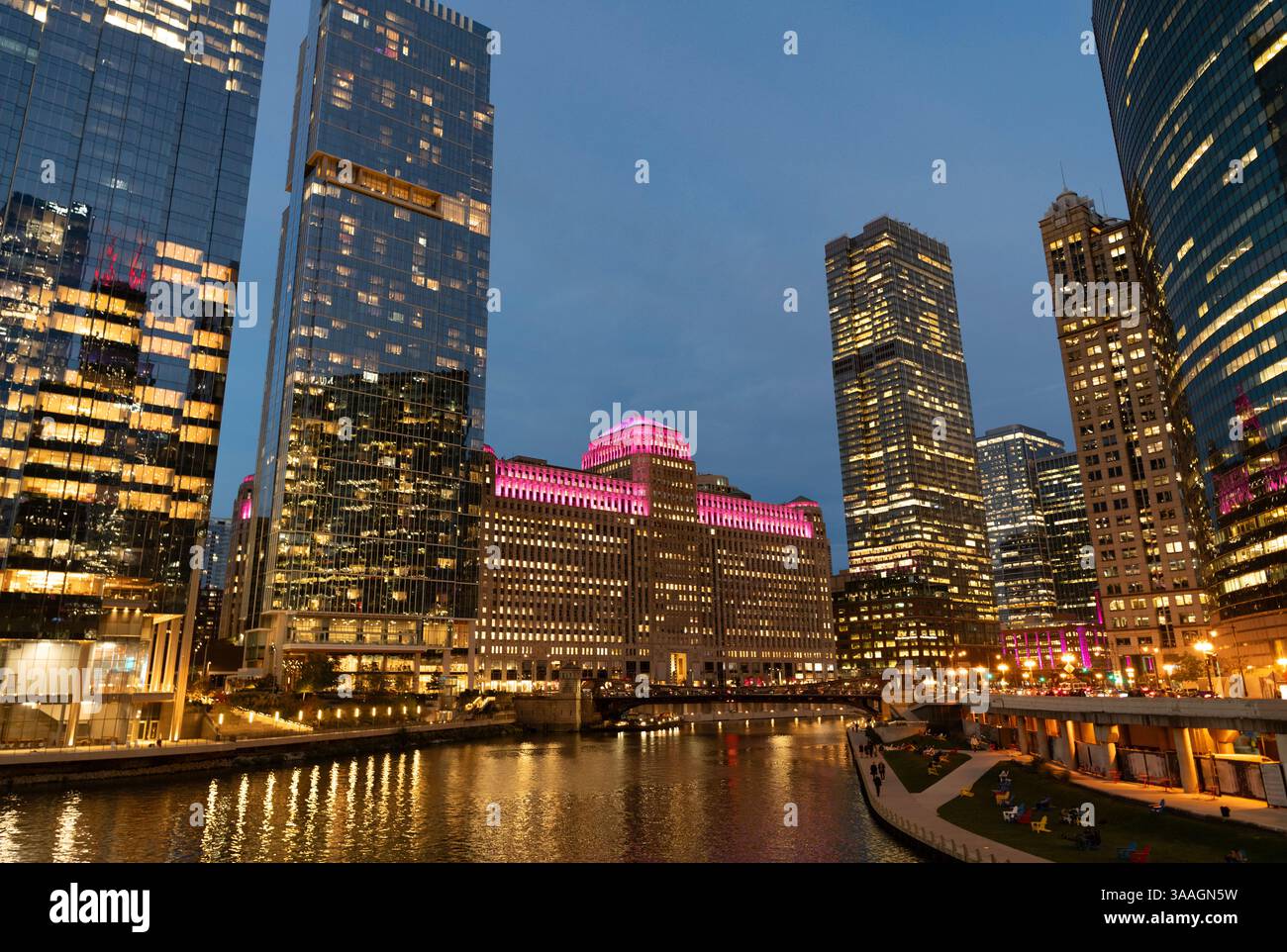 Chicago architecture of skyscraper at river. City night illuminated ...