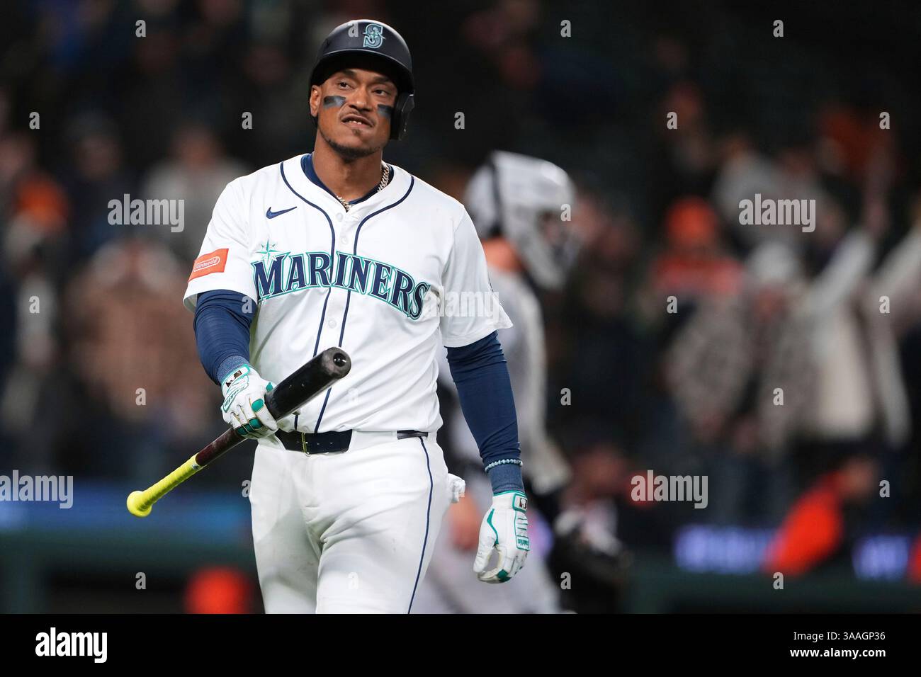 Seattle Mariners' Jorge Polanco walks off the field after lining out ...