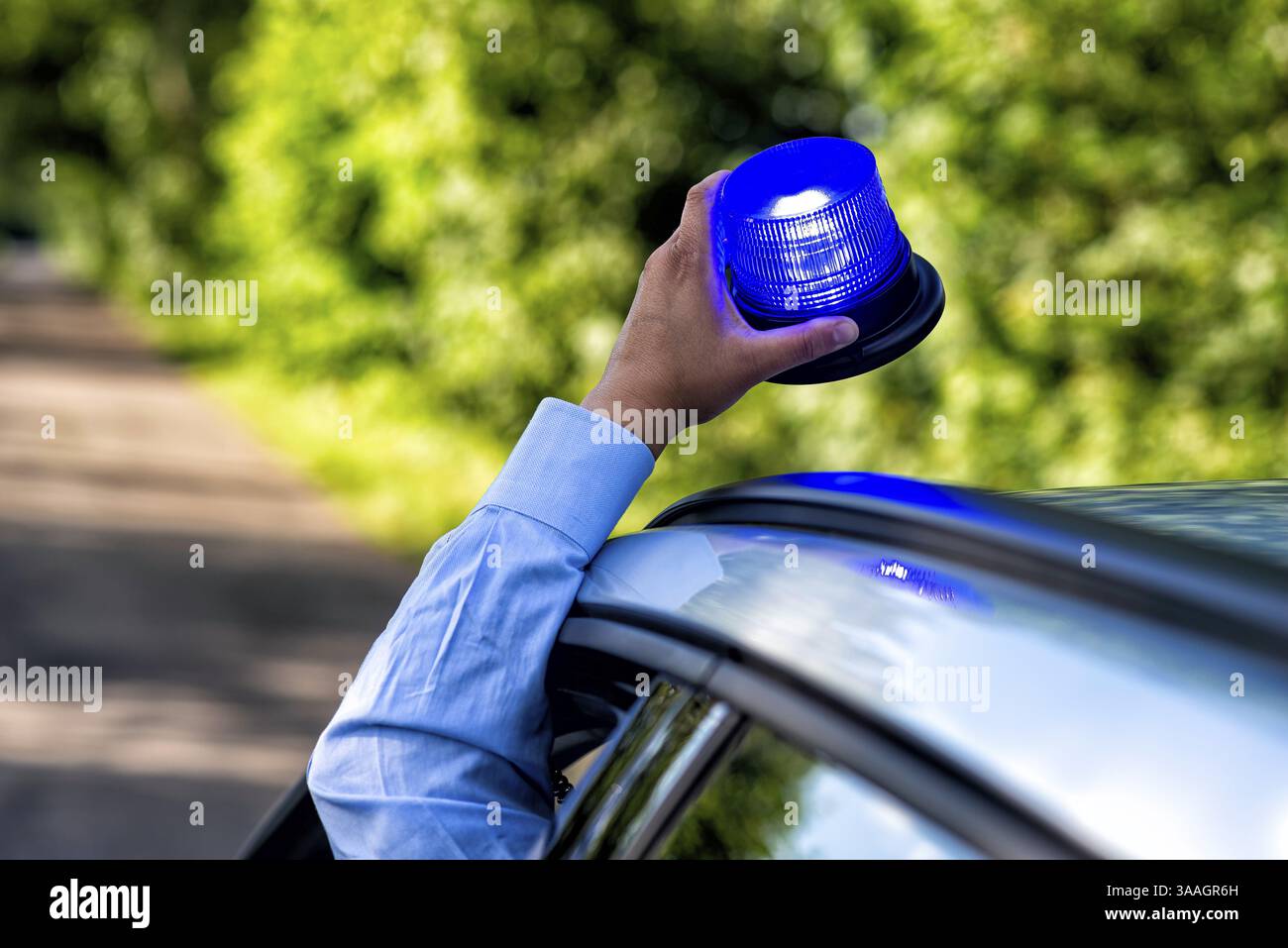 Blue flashing light on a police vehicle during a blue light run Stock ...