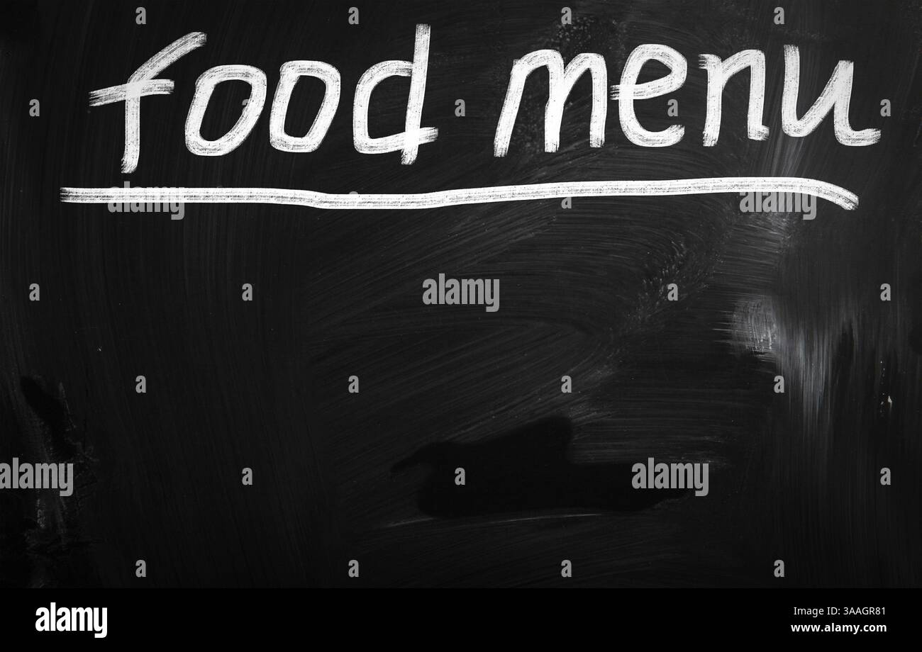 The word Menu handwritten with white chalk on a blackboard Stock Photo ...