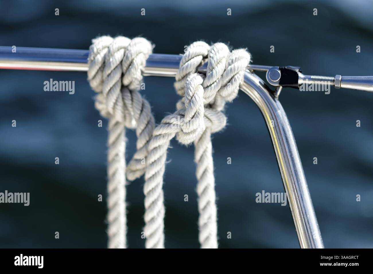 Mooring line on a sailing yacht at sea hanging from the railing Stock ...