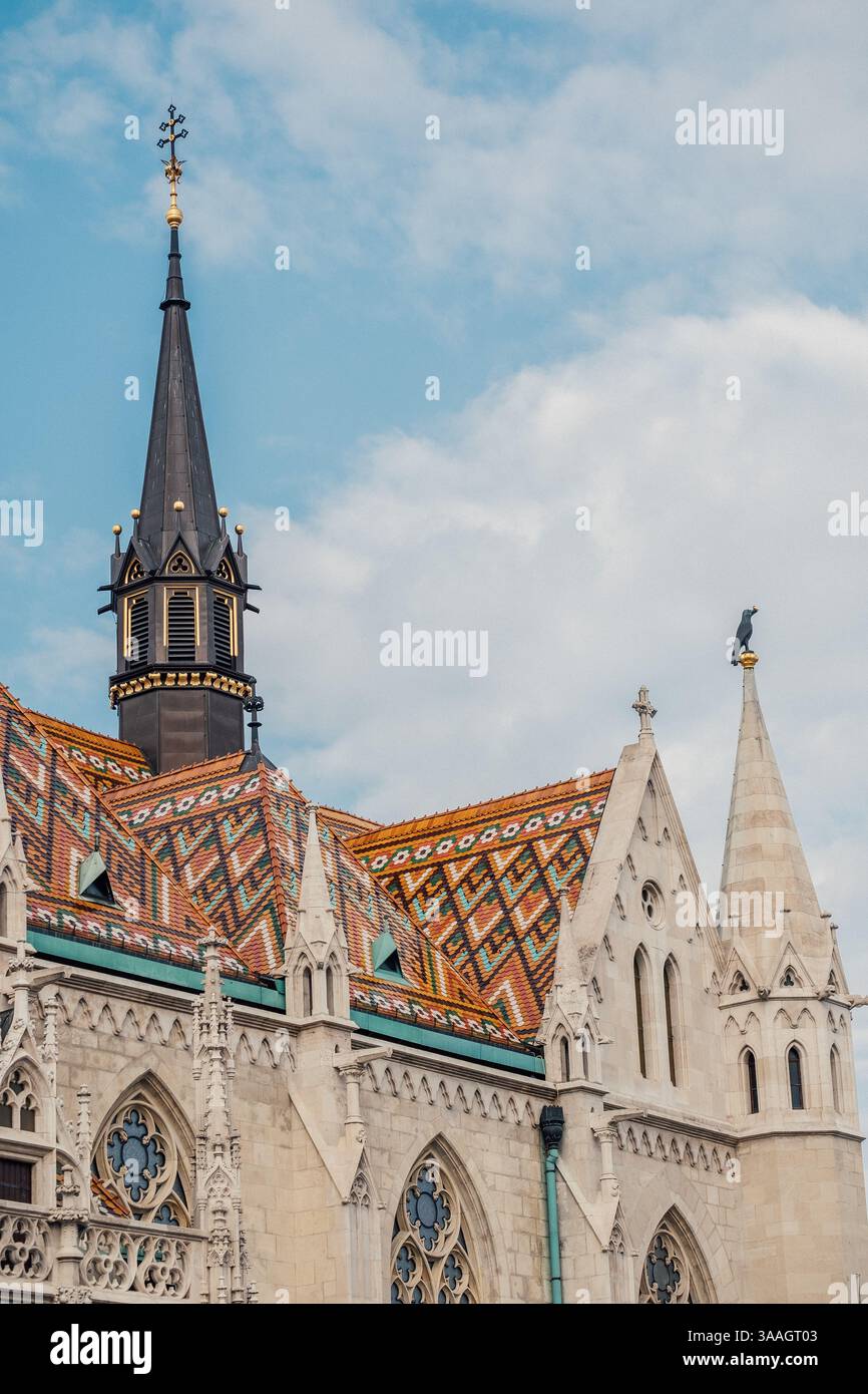 The Church of Our Lady of Buda Castle spires against blue sky and clouds Stock Photo - Alamy