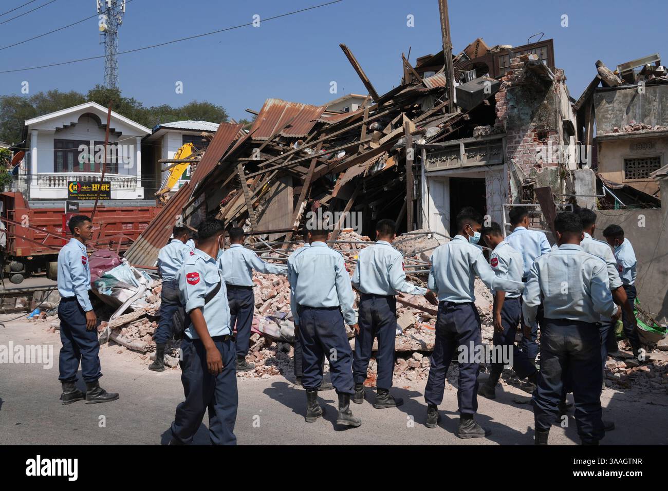 Myanmar's military personnel search through rubble of a collapsed ...