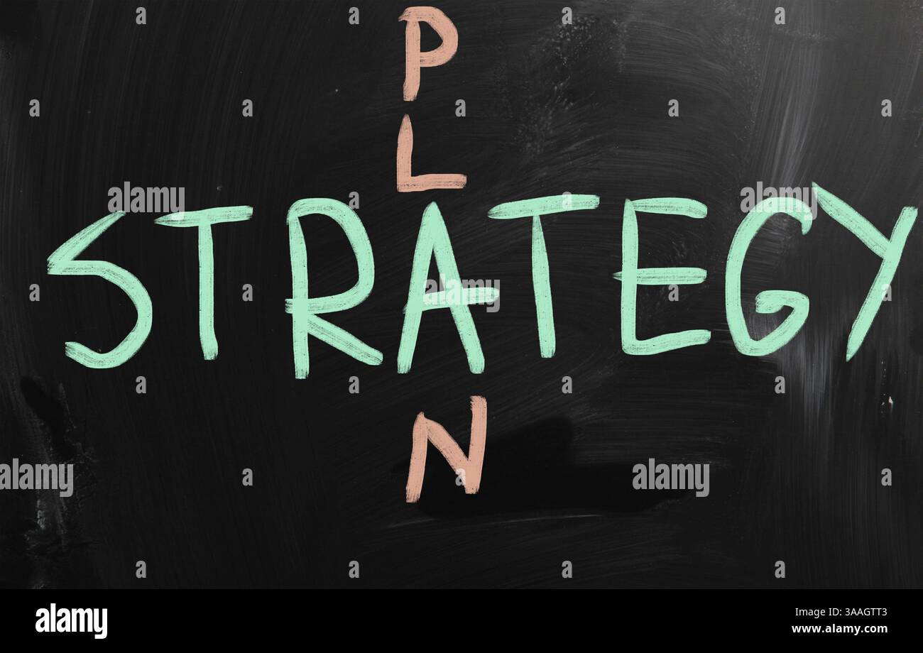 Strategy handwritten with white chalk on a blackboard Stock Photo - Alamy