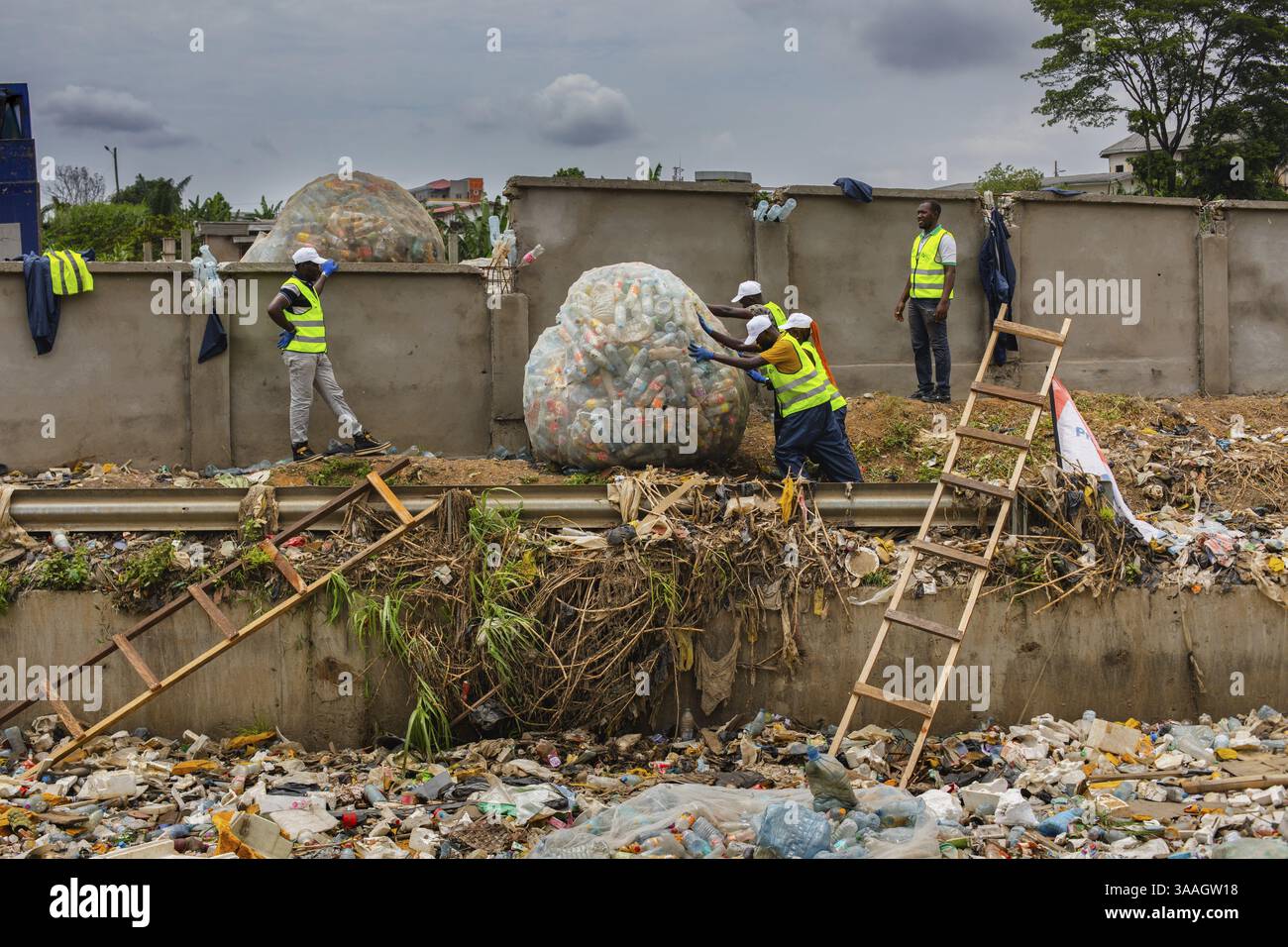 The edge of a riverbed in Douala. Rubbish including plastic bottles ...