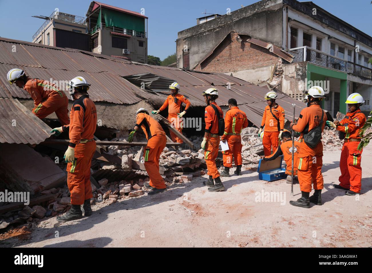 Myanmar's rescuers work through rubble of a collapsed building ...