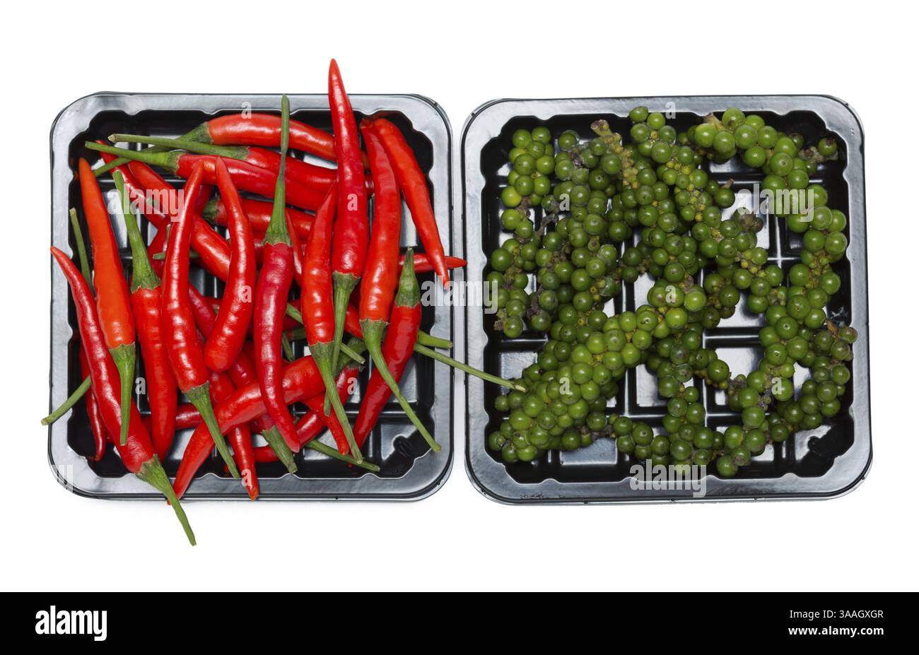 Red and black pepper in a plastic box Stock Photo - Alamy