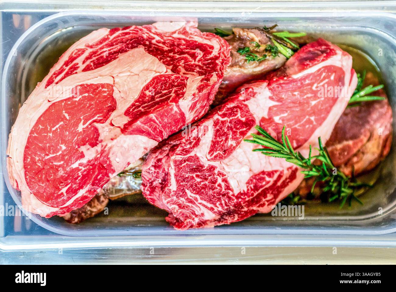 Steaks. Grade A grass fed beef, waygu steaks in butchers block ...
