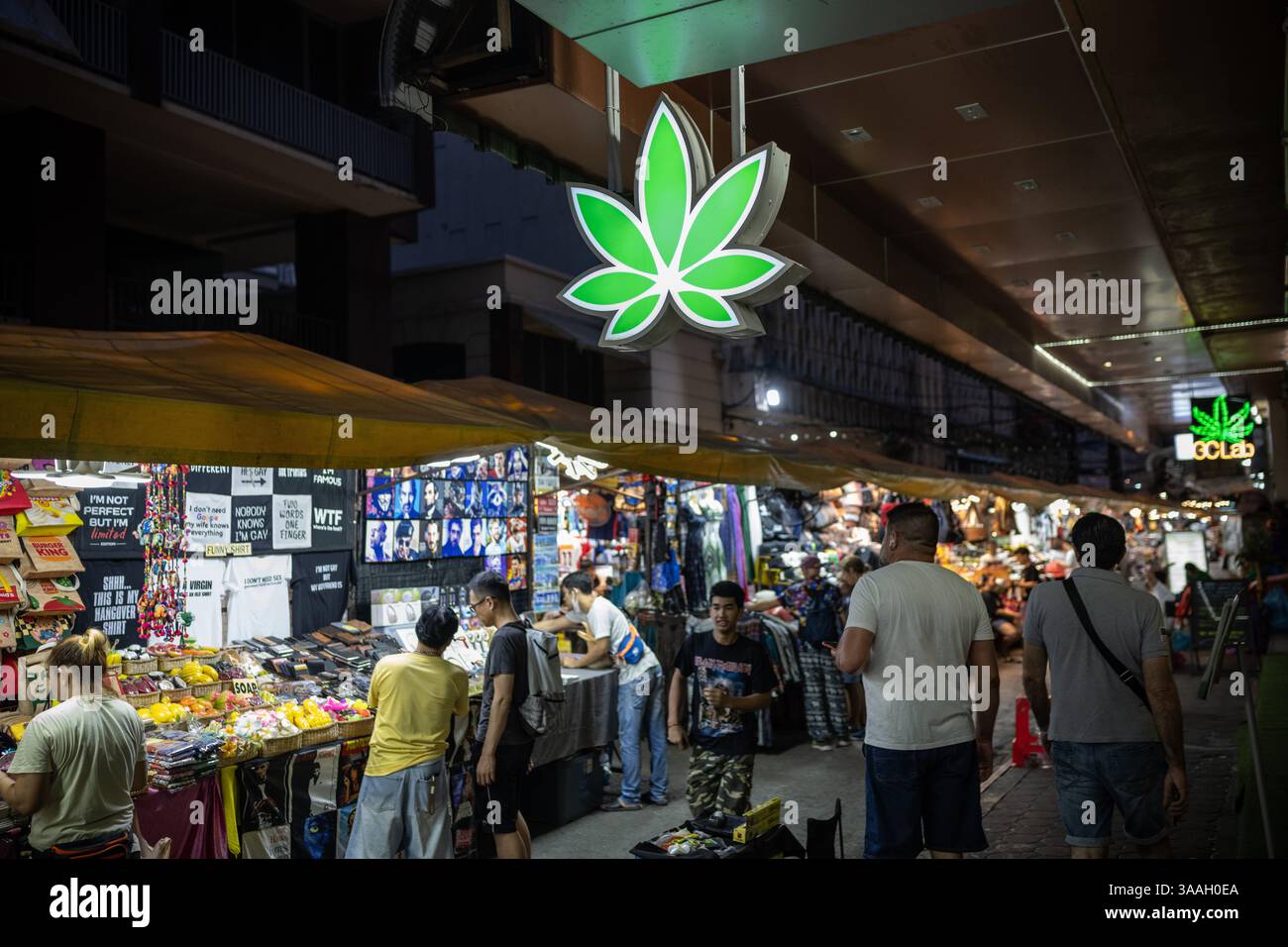 Illuminated neon green cannabis leaf sign a the Patpong Night Market ...