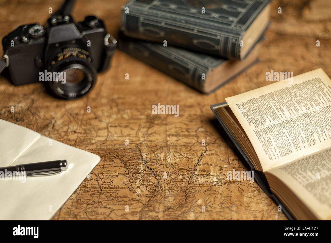 Old expedition map with notebook, other books and old film camera Stock ...