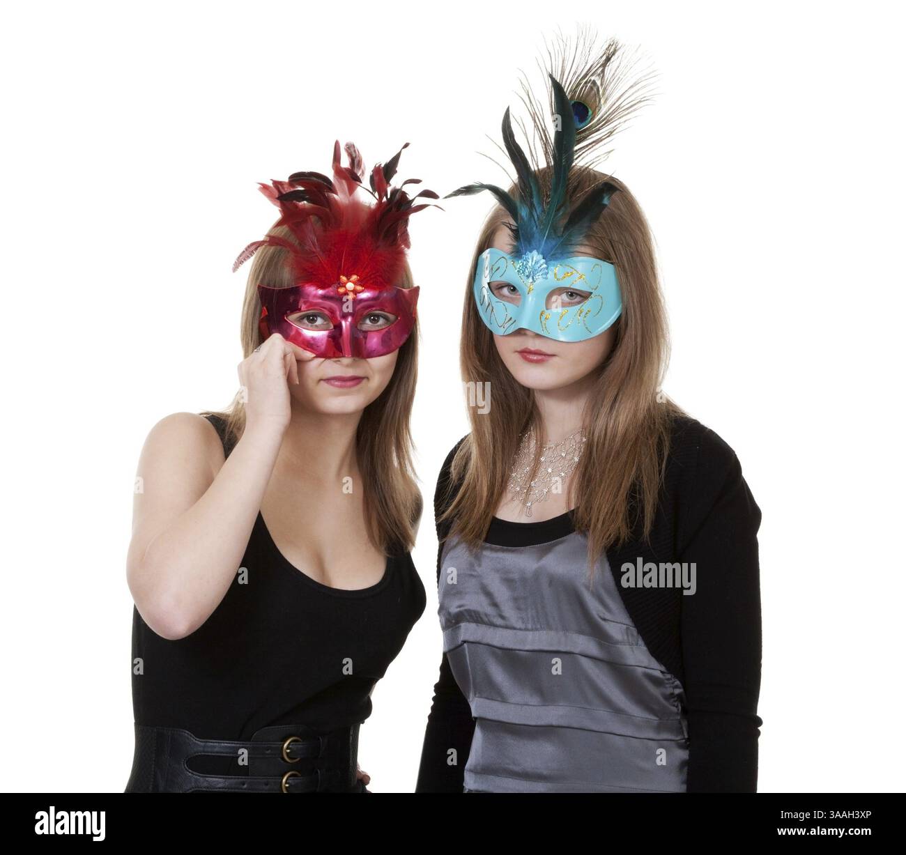 Two girl in the masquerade mask on a white background Stock Photo - Alamy