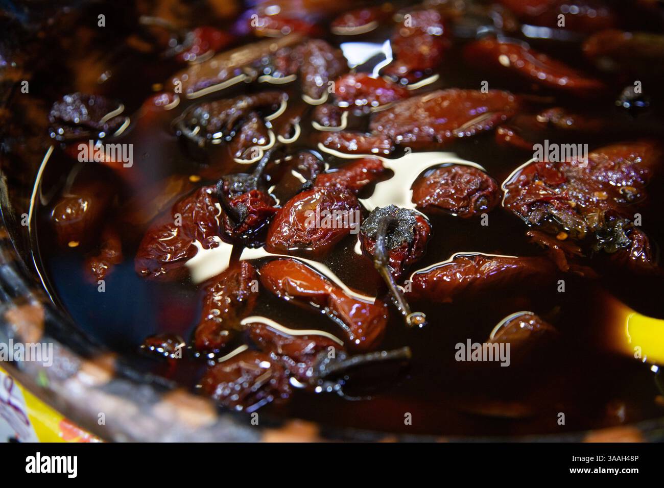 Traditional food stall with moles, nopales, and chiles in clay pots at ...