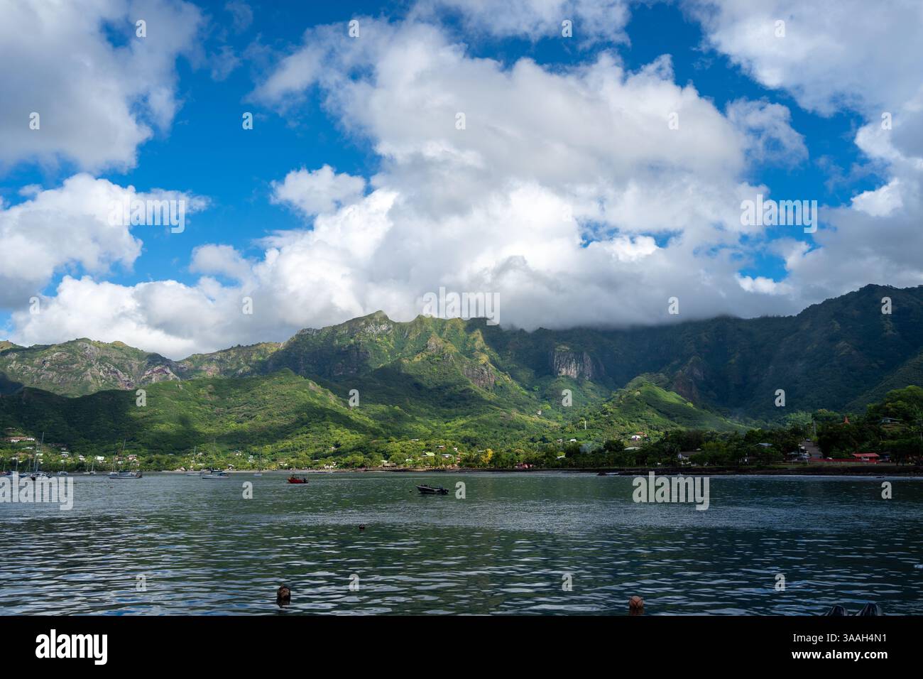Taiohae Bay in Nuku Hiva, Marquesas Islands, is surrounded by green ...