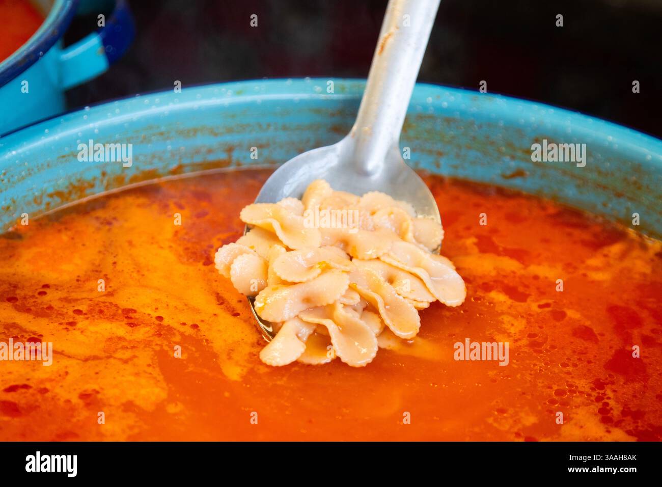 Traditional food stall with moles, nopales, and chiles in clay pots at ...