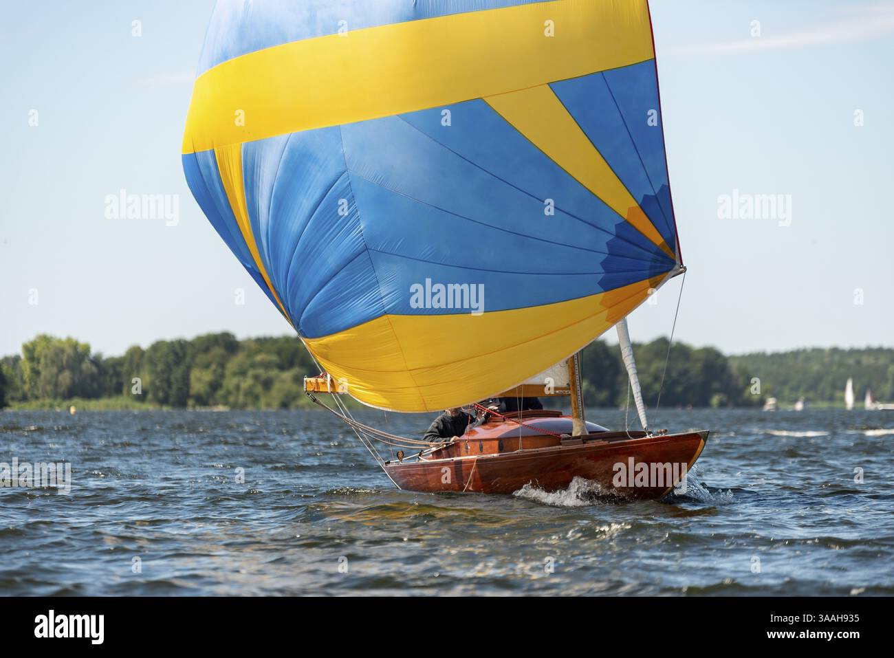 Classic sailing yacht with spinnaker on a lake during a regatta Stock ...