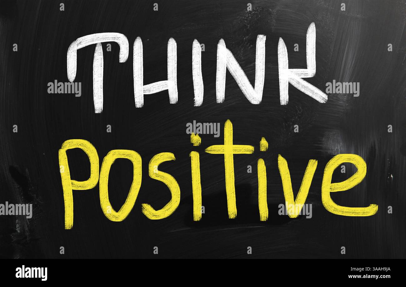 Think positive handwritten with chalk on a blackboard Stock Photo - Alamy