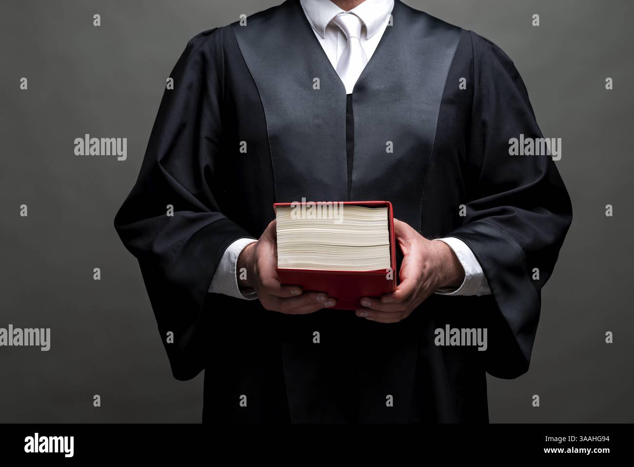German lawyer with classic black robe, white tie and book Stock Photo ...