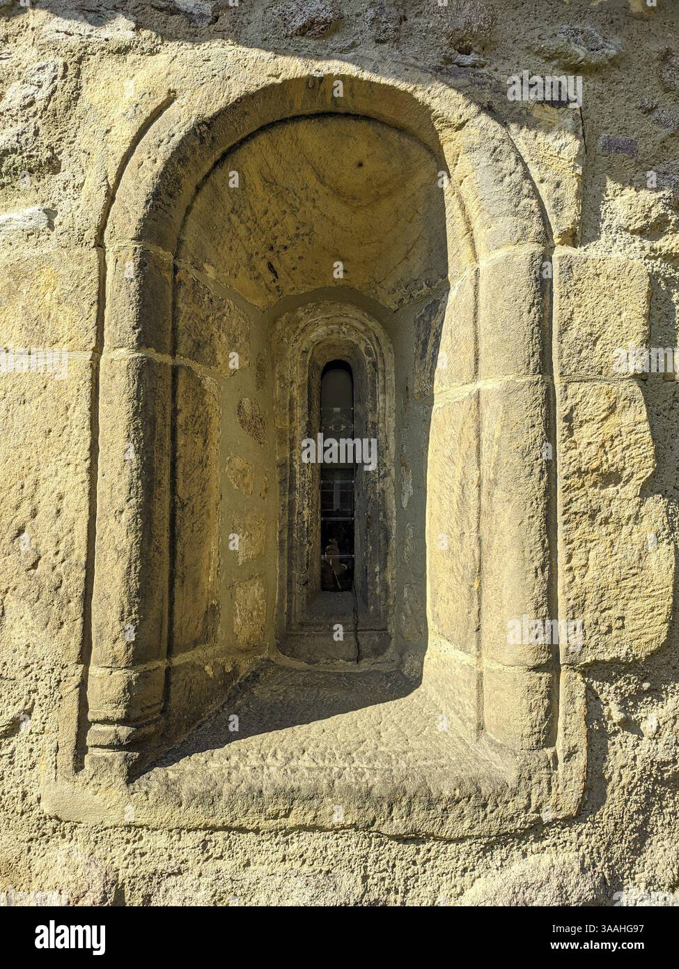 Medieval Romanesque sandstone window from the 12th century in a quarry ...