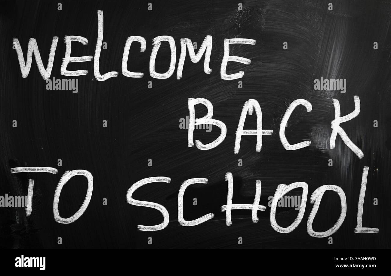 Welcome back to school handwritten with white chalk on a blackboard ...