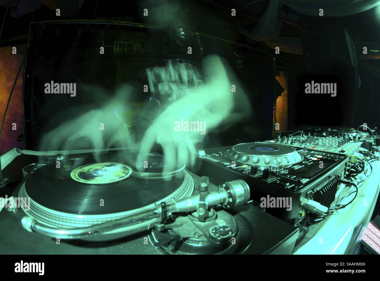 Blurred dj at spin table in night club Stock Photo - Alamy