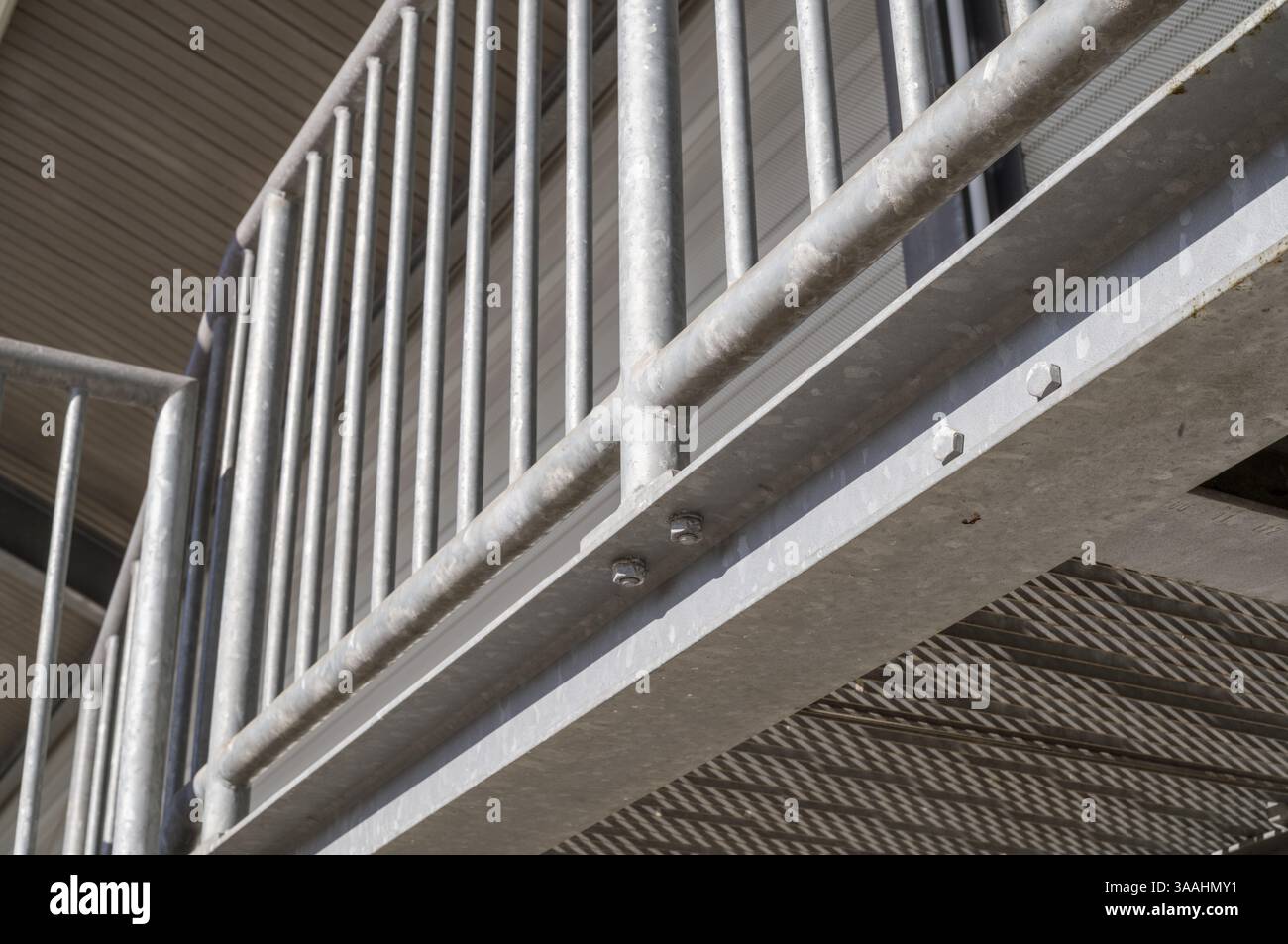 Close-up of a metal balcony railing featuring vertical bars ...