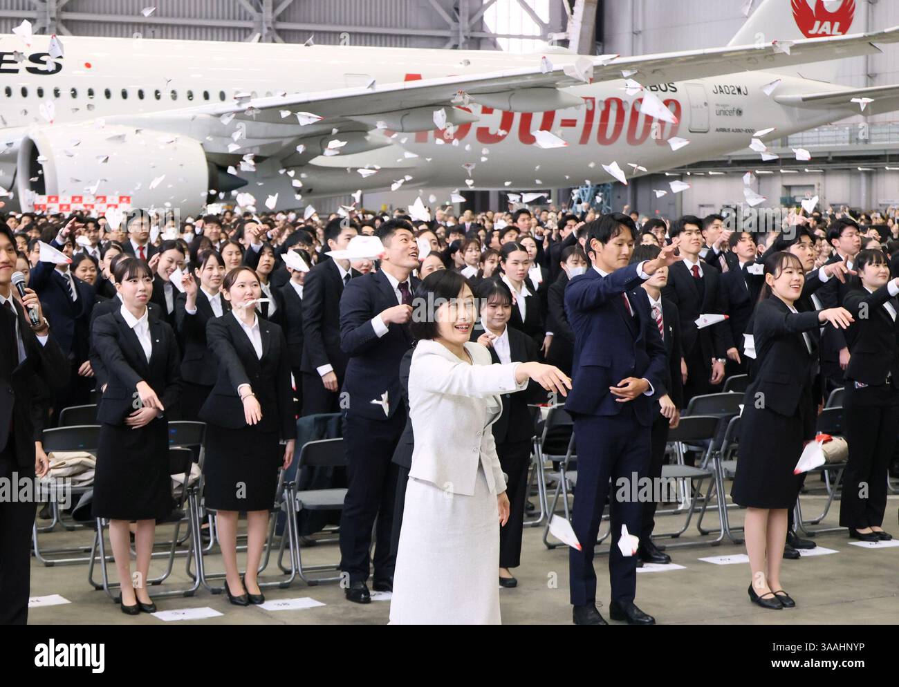April 1, 2025, Tokyo, Japan - Japan Airlines (JAL) president Mitsuko Tottori (C) and newly hired ...