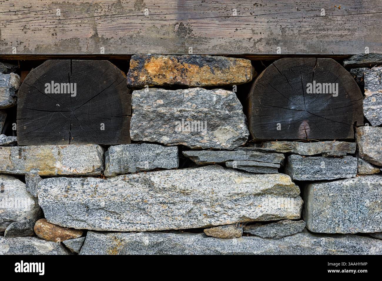 Craftsmanship is on display in this close-up of a stone and log ...