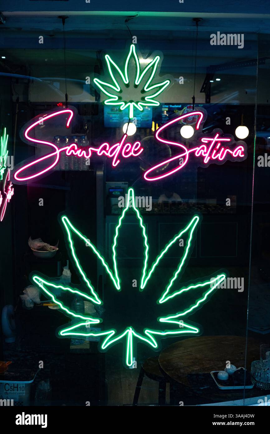 Bangkok, Thailand. 12th Mar, 2025. Illuminated neon green cannabis leaf ...