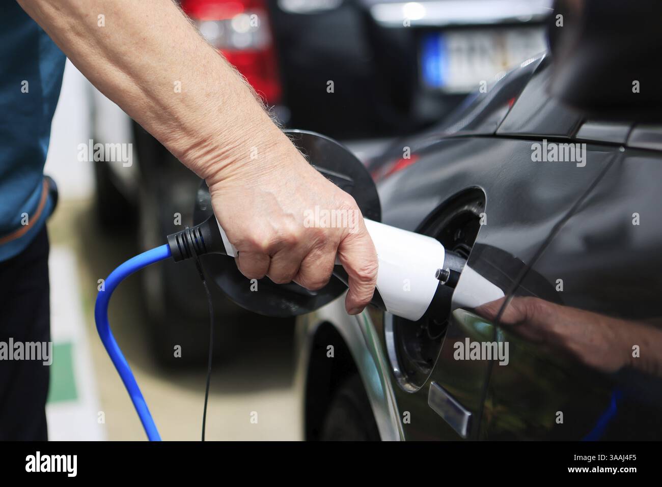 E-Mobility, Charging an electric car Stock Photo - Alamy